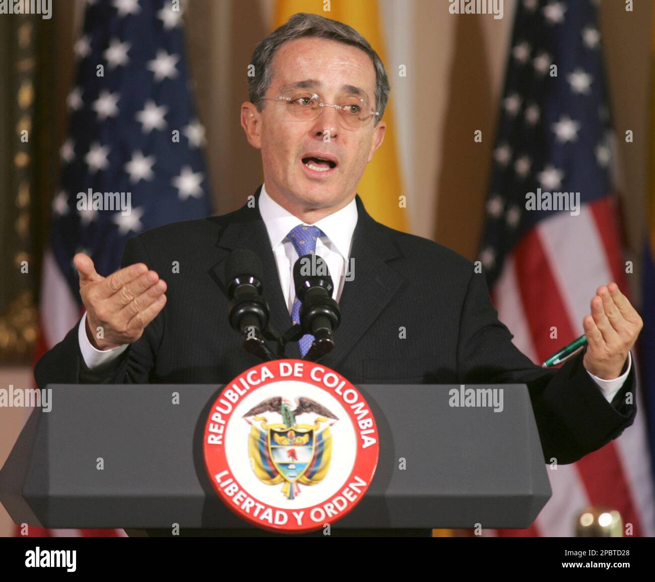 Colombia's President Alvaro Uribe talks with reporters during a news ...