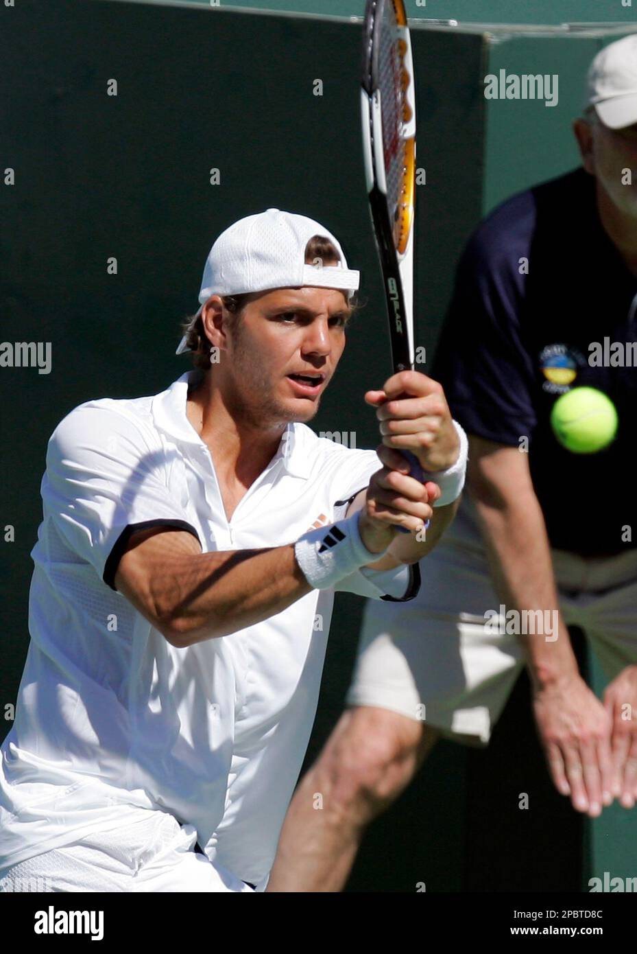 Paul-Henri Mathieu of France returns a shot to Mardy Fish during second ...