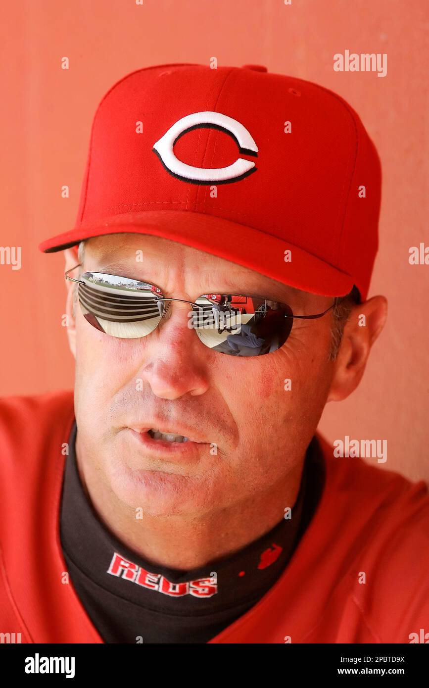 Cincinnati Reds manager Jerry Narron sits in the dugout before spring ...