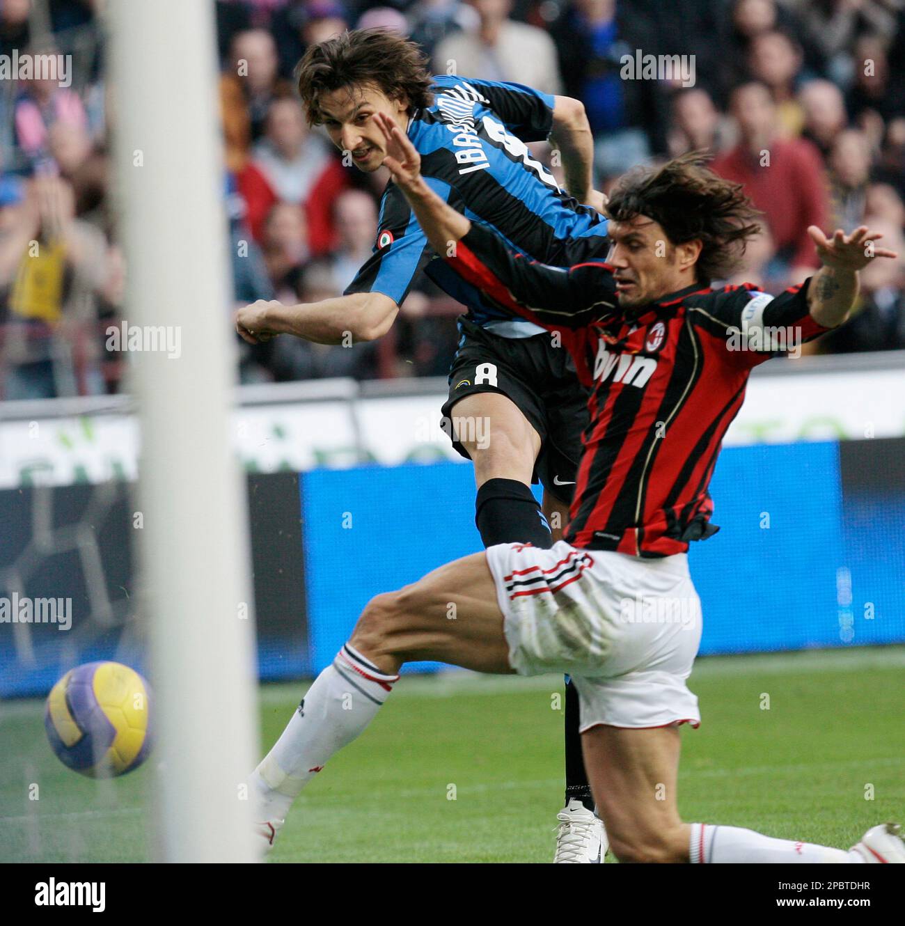 AC Milan's defender Paolo Maldini, right, tries to stop a kick by Inter ...