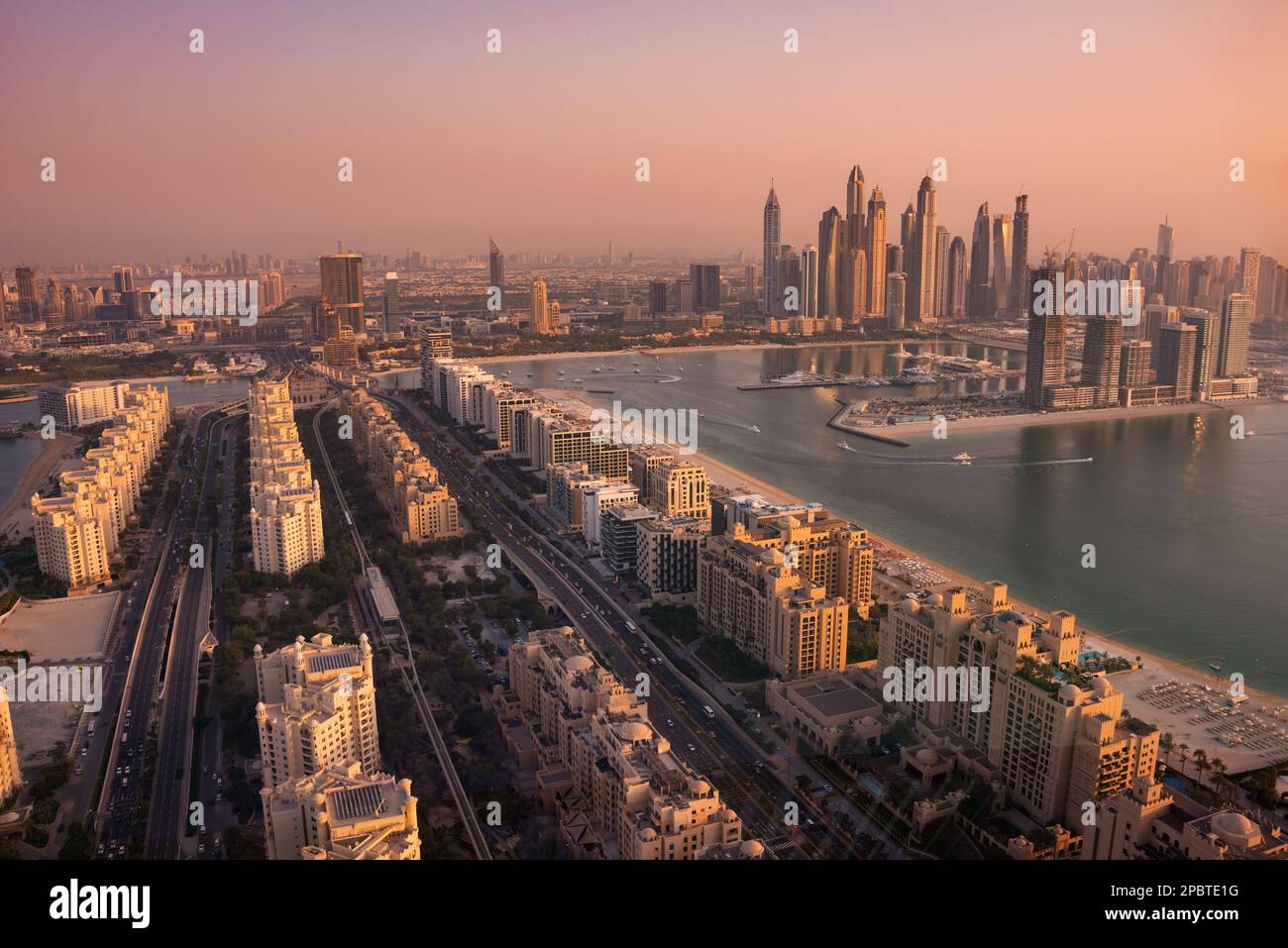 Dubai skyline on sunset, modern city with skyscrapers seen from water ...