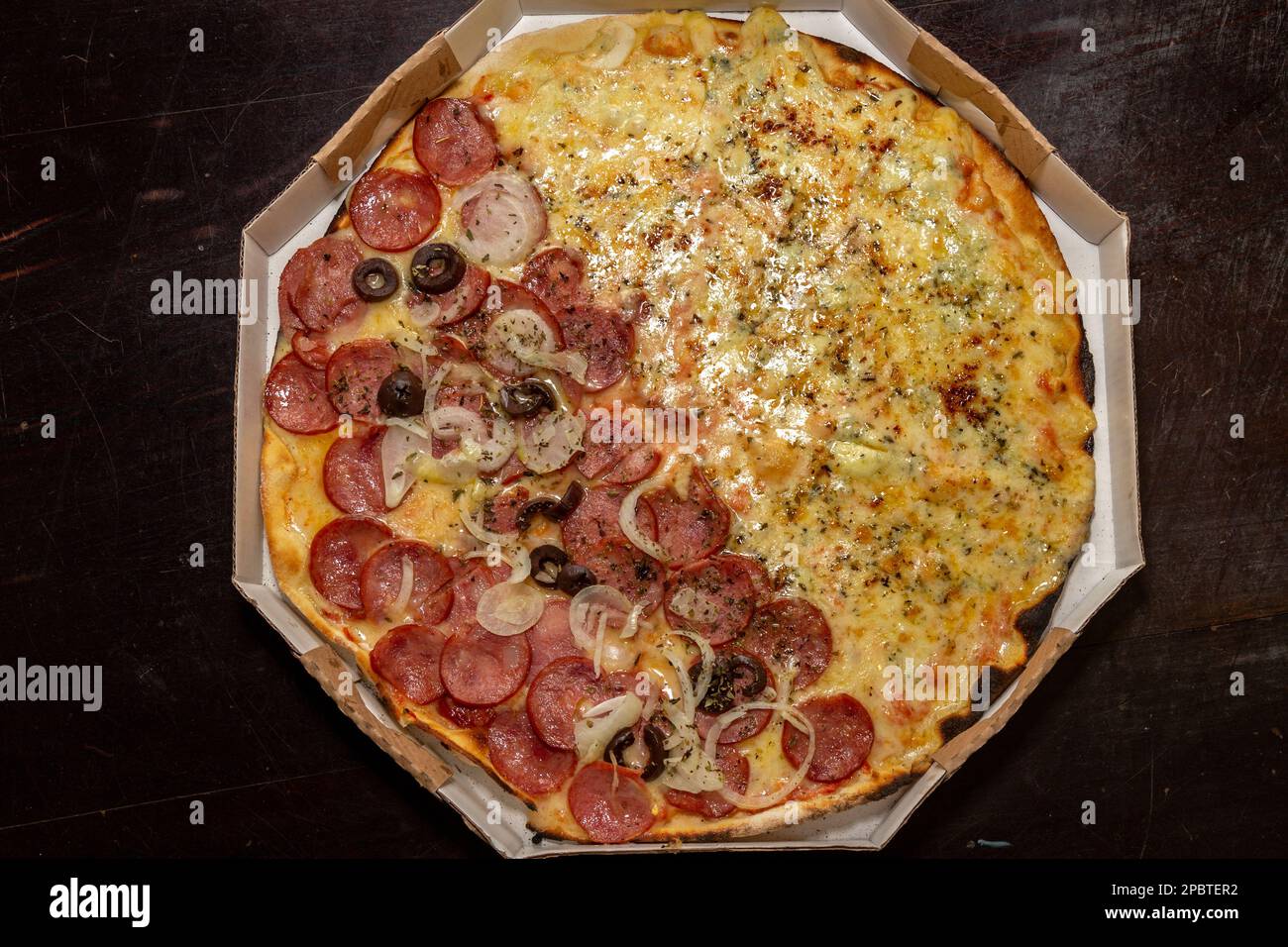 Traditional Brazilian pizza half pepperoni sausage and half four ...