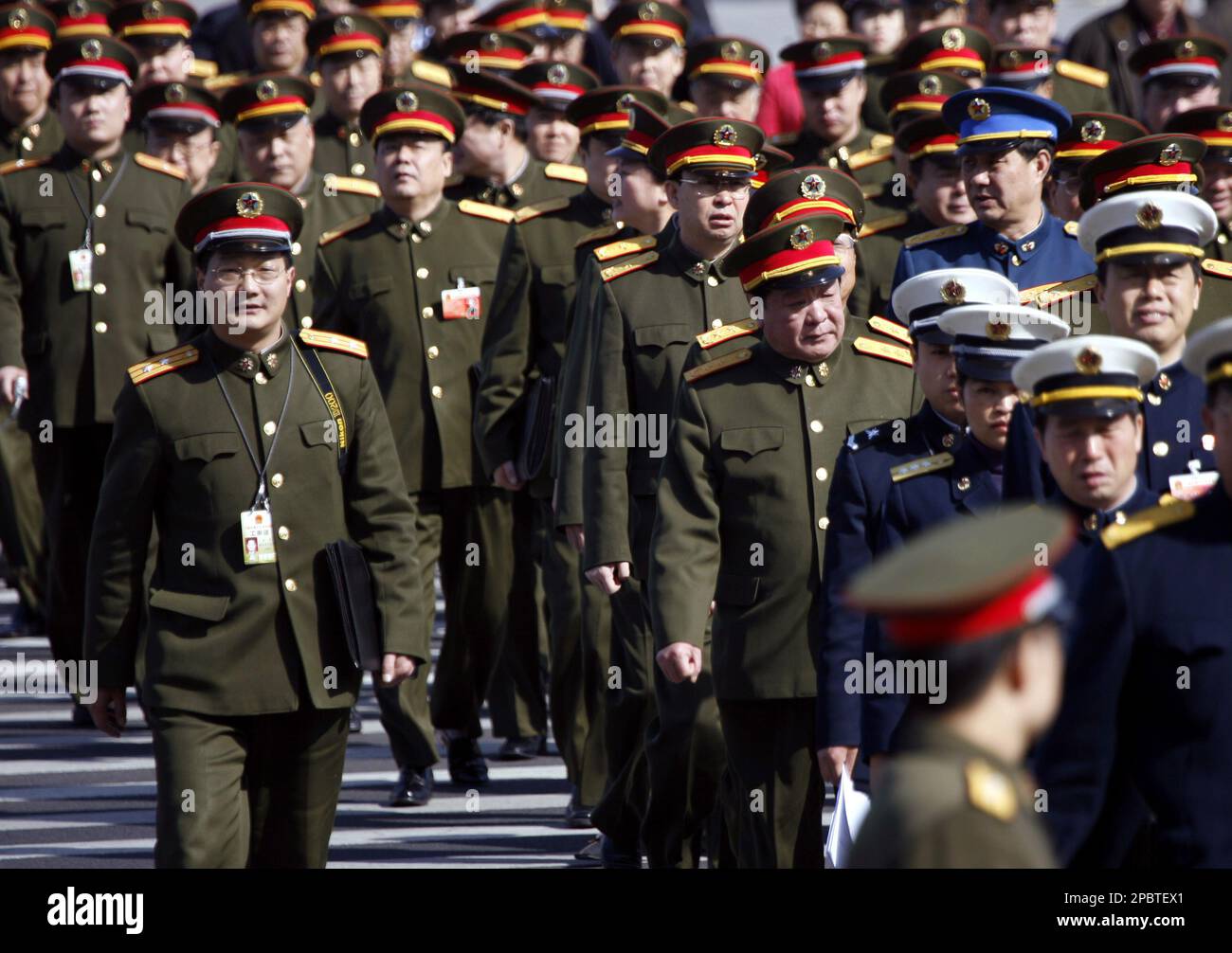 Chinese military officers arrive at the Great Hall of the People where ...