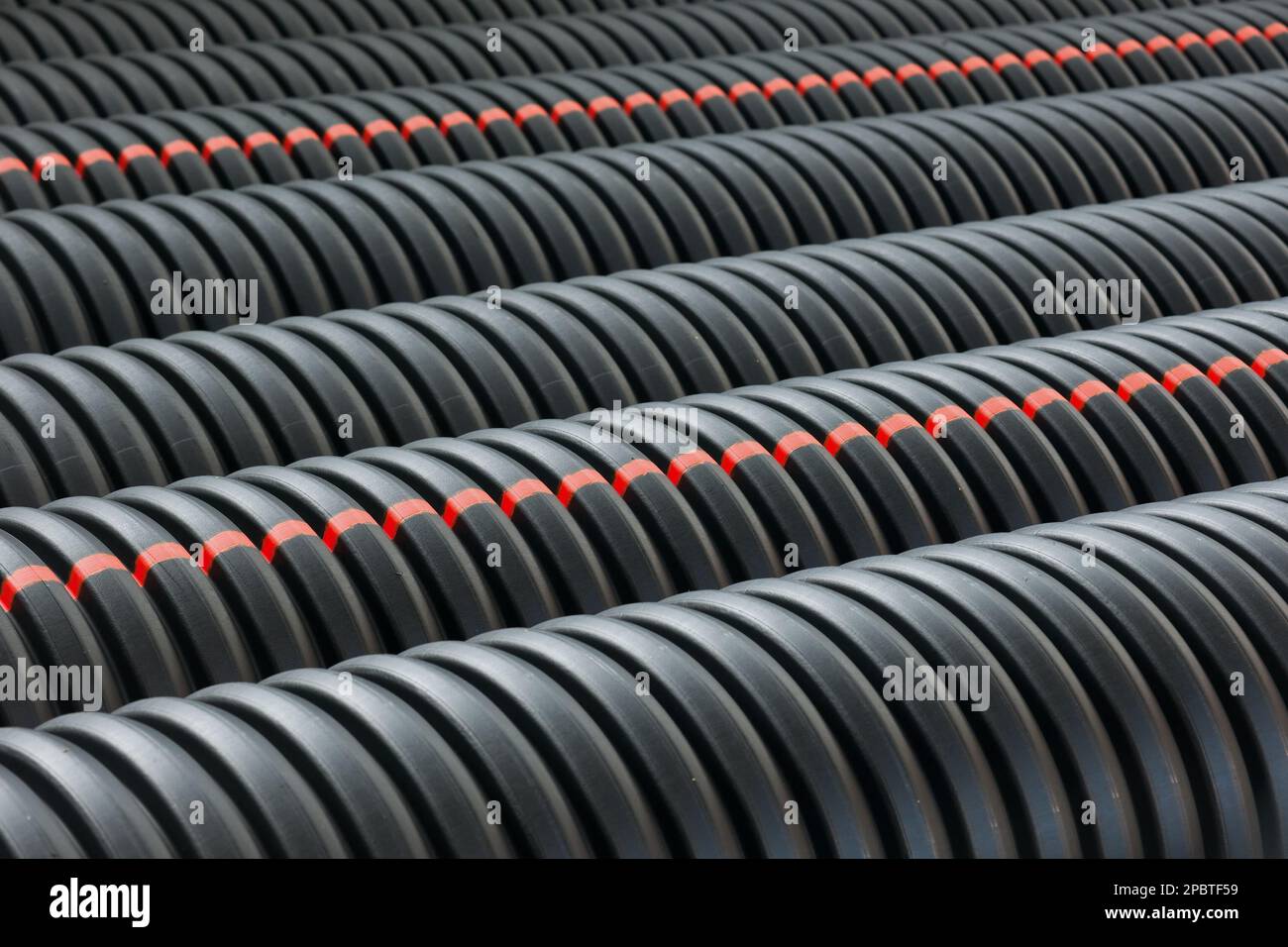 Bunches of PVC pipe sitting on palets at a wholesale pipe store Stock ...