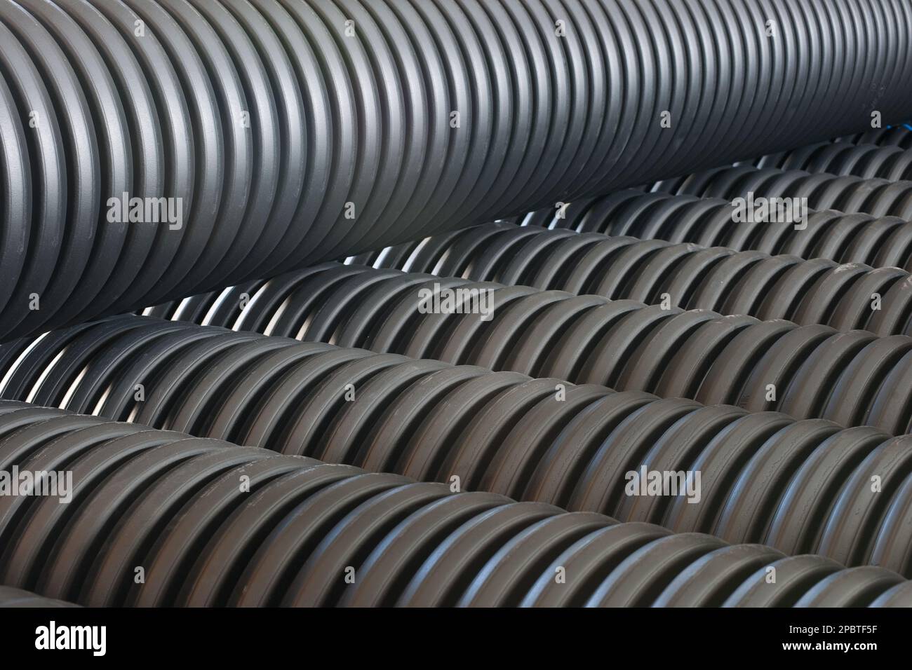 Bunches of PVC pipe sitting on palets at a wholesale pipe store Stock ...