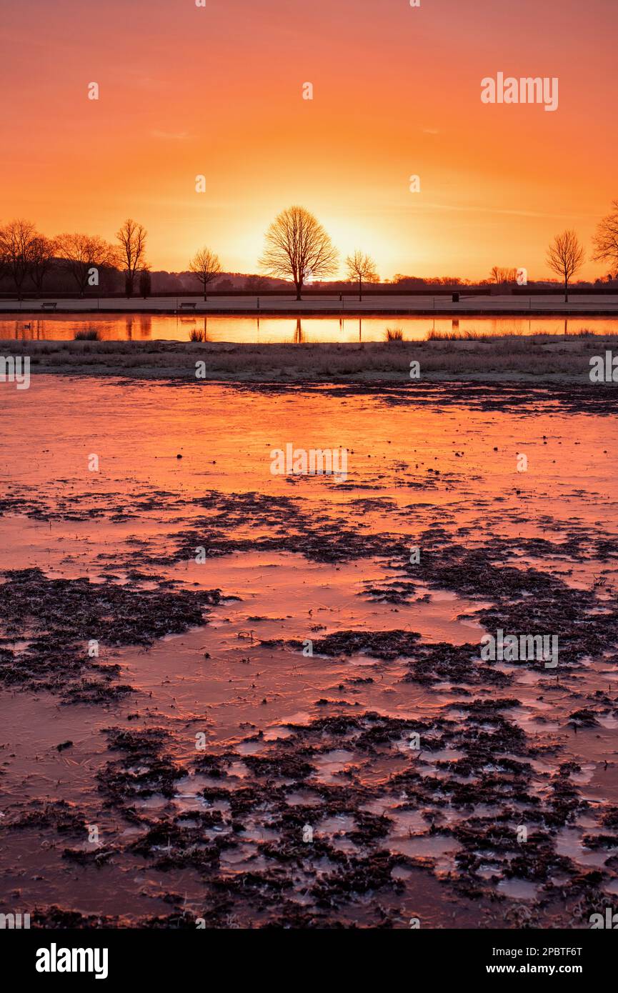 Frozen flood water at sunrise along the River Thames. Henley on Thames ...