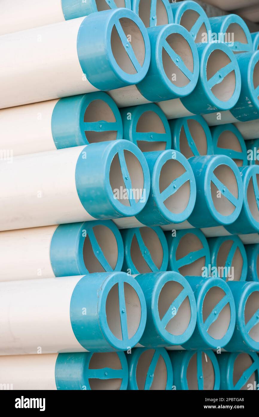Bunches of PVC pipe sitting on palets at a wholesale pipe store Stock ...
