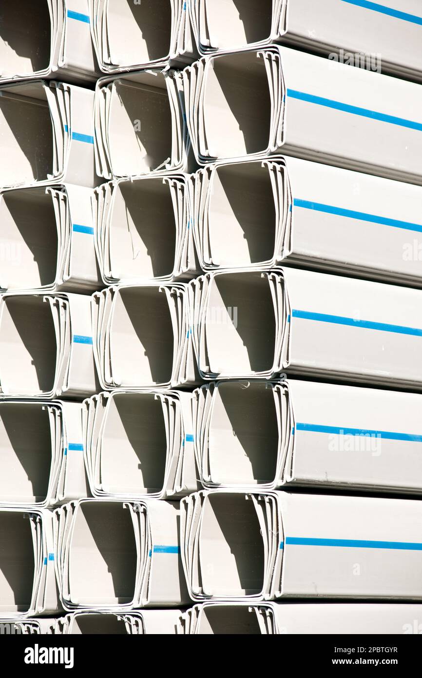 Bunches of PVC pipe sitting on palets at a wholesale pipe store Stock ...