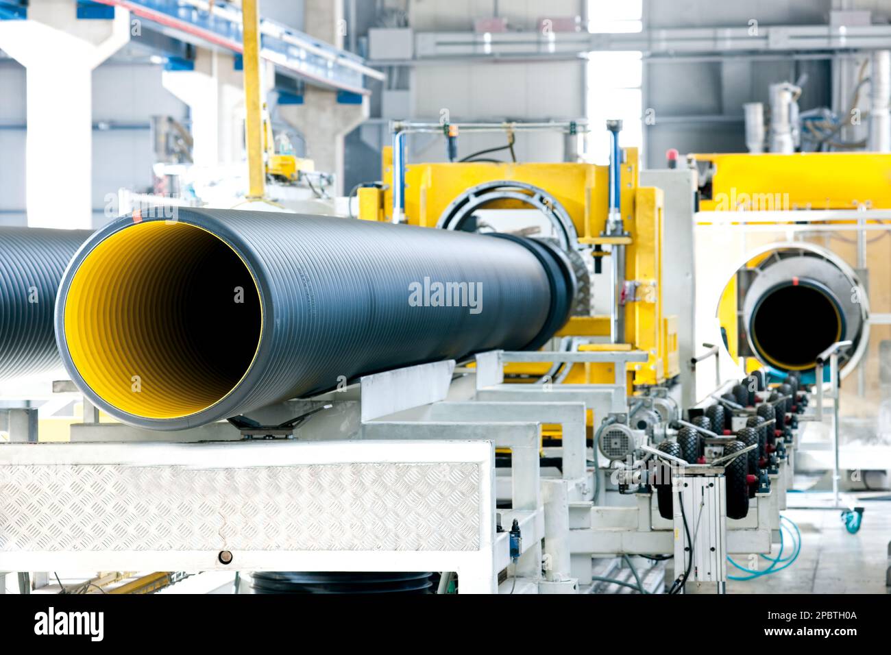 Bunches of PVC pipe sitting on palets at a wholesale pipe store Stock ...