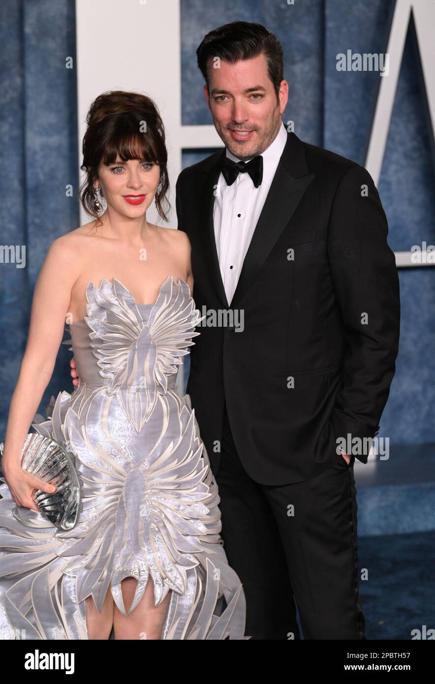 Jonathan Scott and Zooey Deschanel attend the Vanity Fair Oscar Party ...