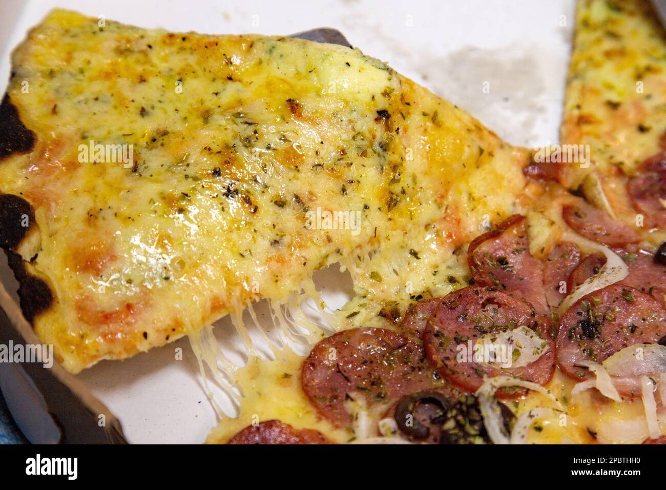 Traditional Brazilian pizza half pepperoni sausage and half four ...