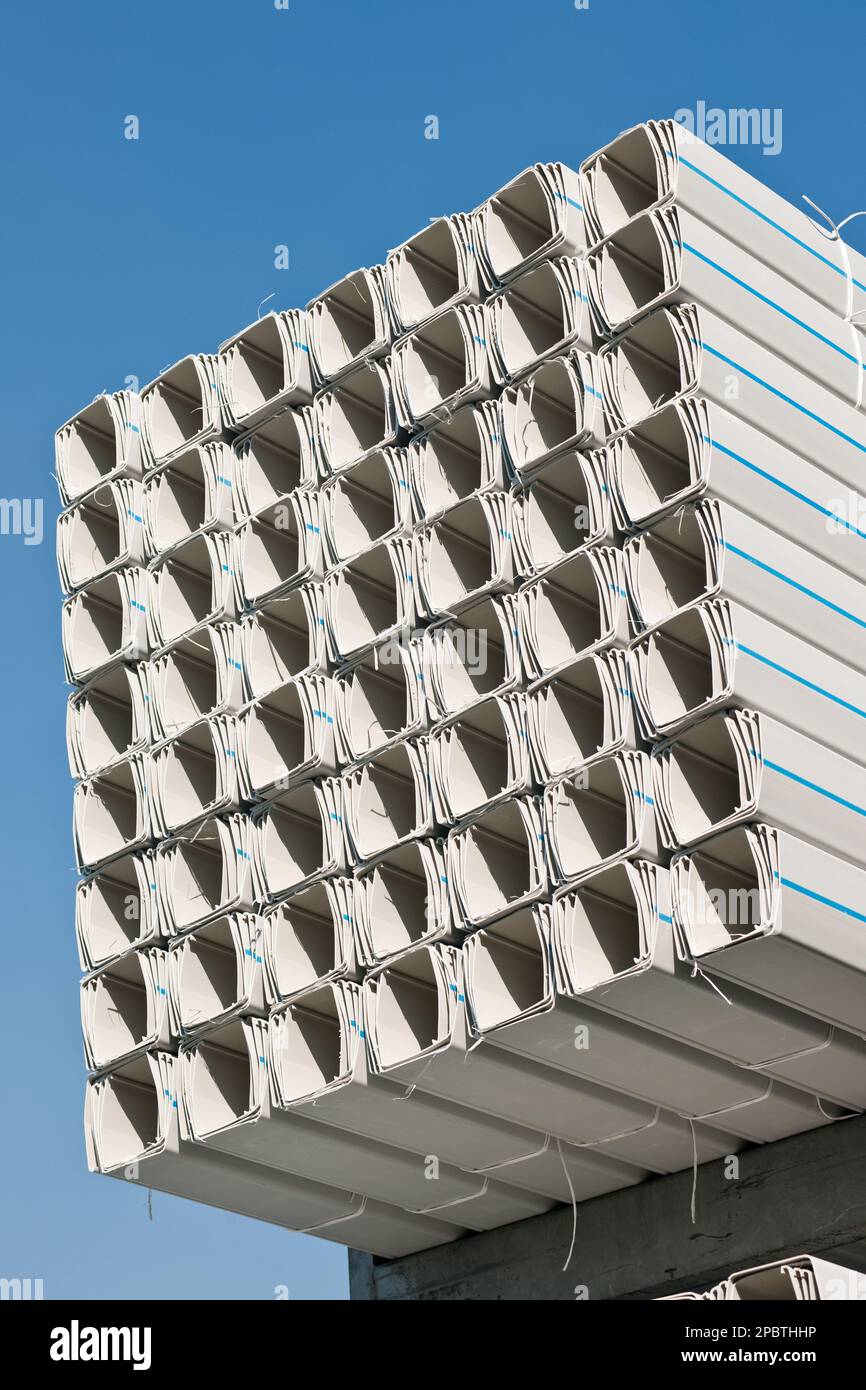 Bunches of PVC pipe sitting on palets at a wholesale pipe store Stock ...