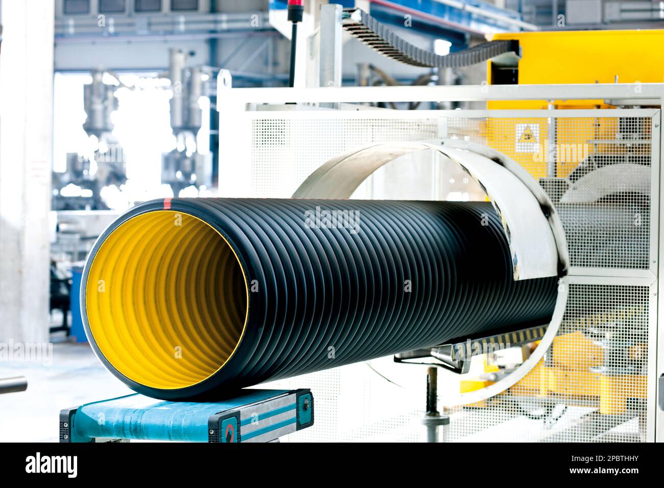 Bunches of PVC pipe sitting on palets at a wholesale pipe store Stock ...