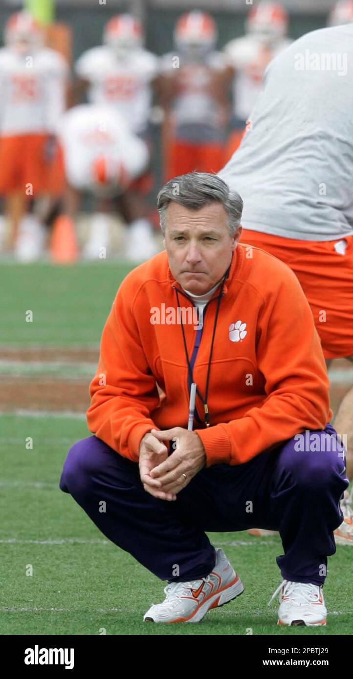 Clemson head football coach Tommy Bowden, center, looks on as his team ...
