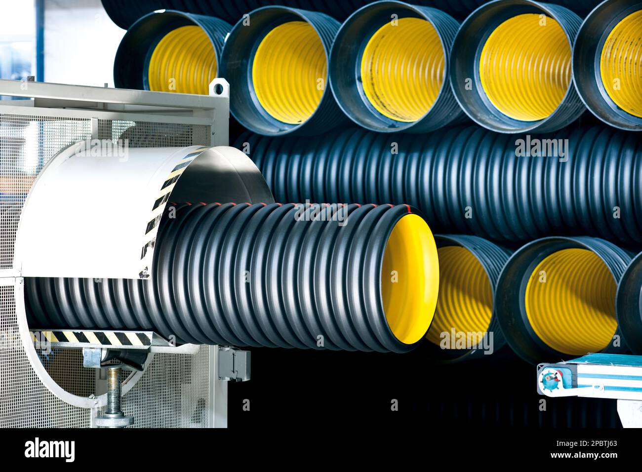 Bunches of PVC pipe sitting on palets at a wholesale pipe store Stock ...