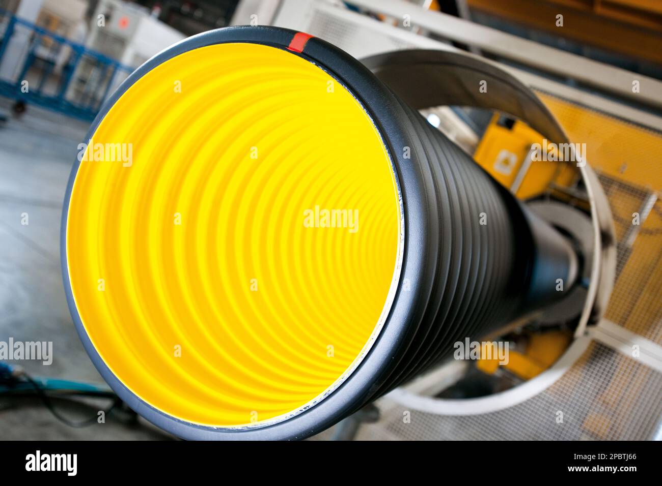 Bunches of PVC pipe sitting on palets at a wholesale pipe store Stock ...