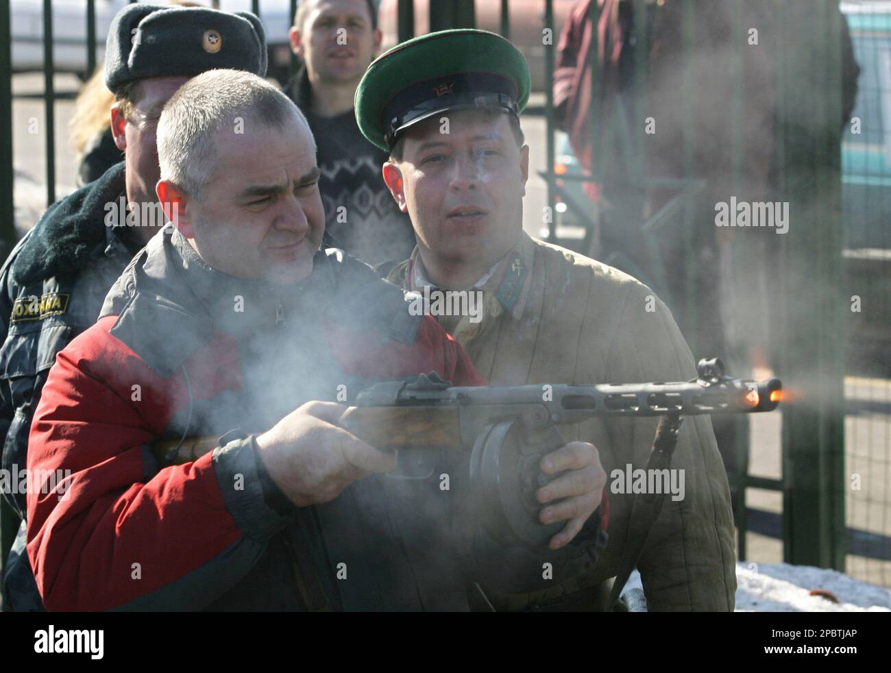 A man shoots a World War II era Soviet submachine gun charged with ...