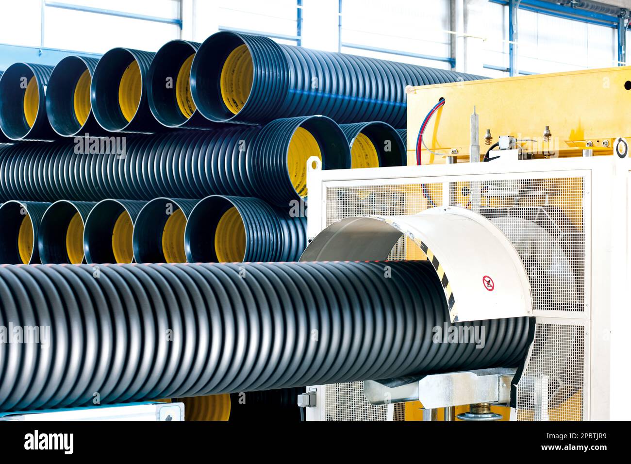 Bunches of PVC pipe sitting on palets at a wholesale pipe store Stock ...