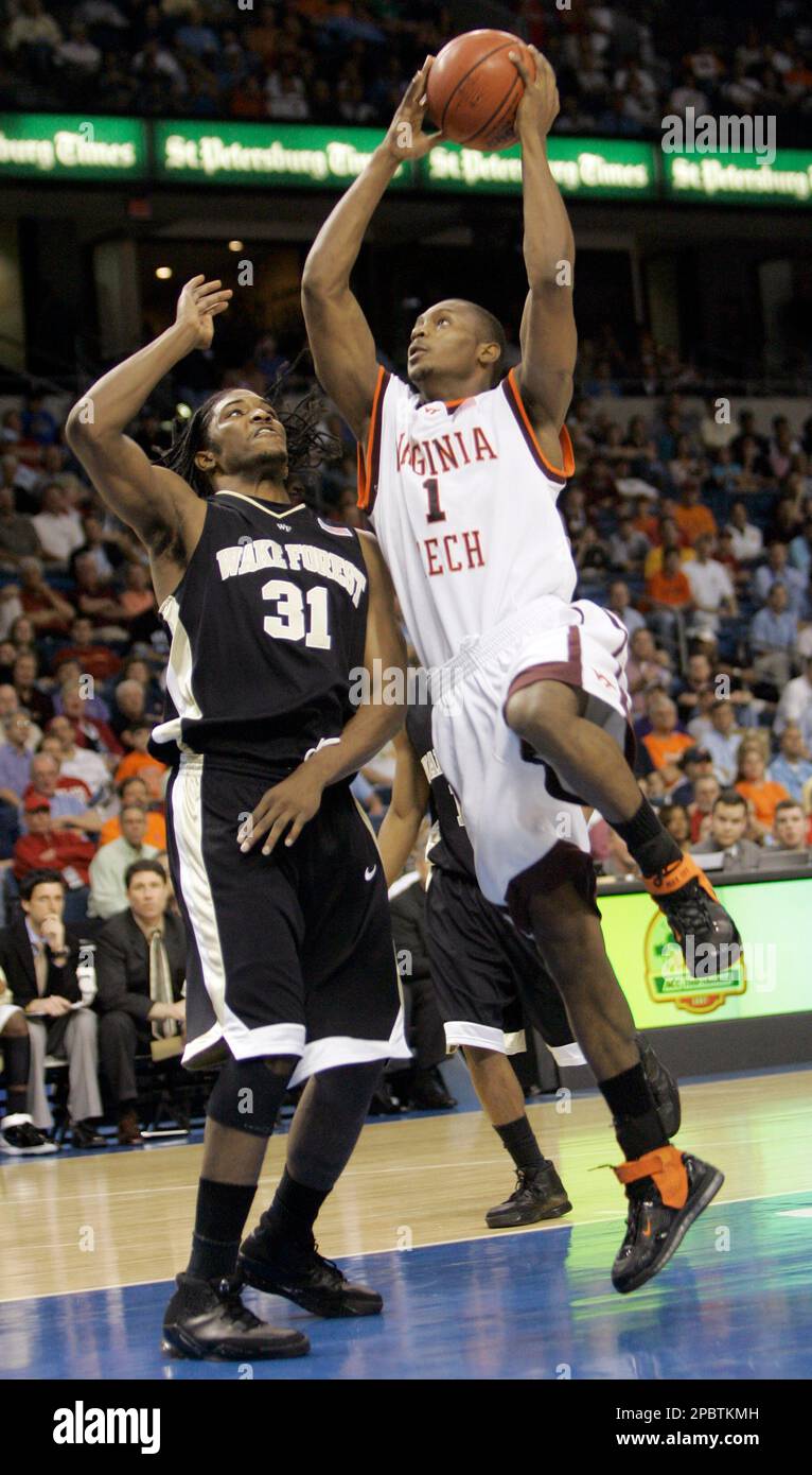 Virginia Tech's Zabian Dowdell (1) drives by Wake Forest's Jamie Skeen ...