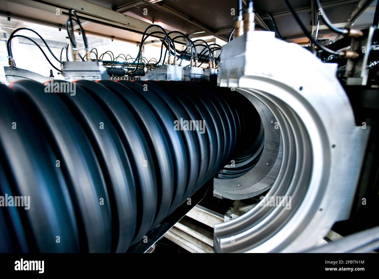 Bunches of PVC pipe sitting on palets at a wholesale pipe store Stock ...