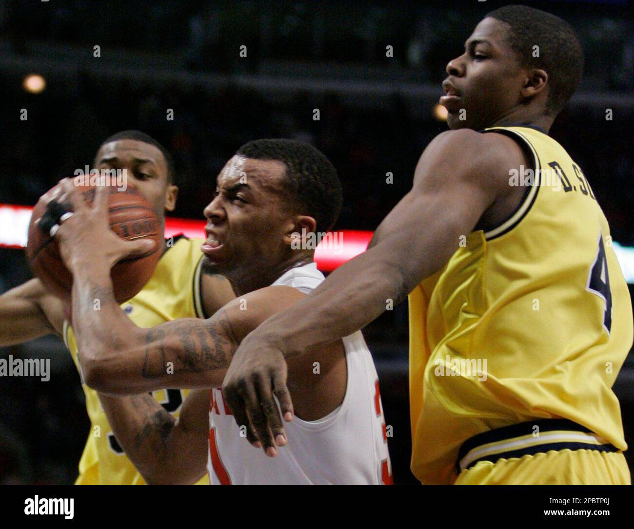 Ohio State guard Daequan Cook tries to break away from Michigan's ...
