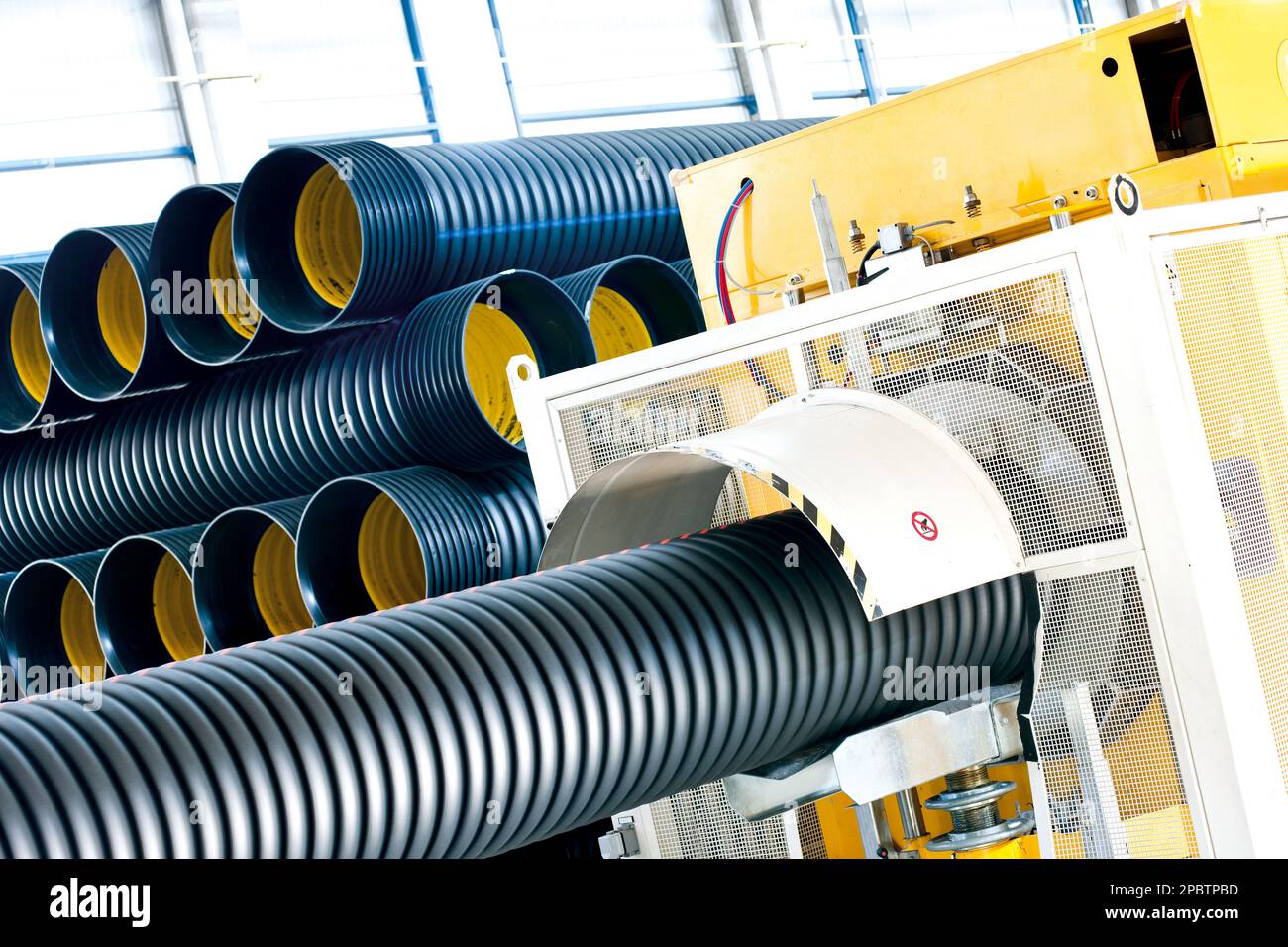 Bunches of PVC pipe sitting on palets at a wholesale pipe store Stock ...