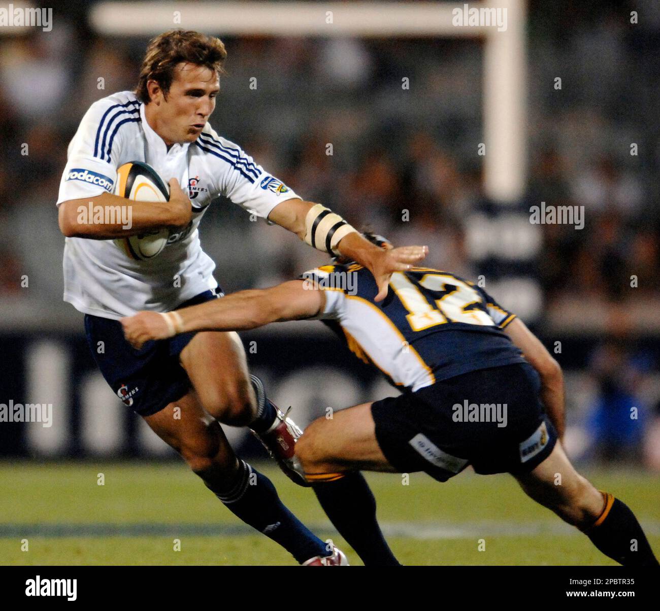 South African Stormers' Peter Grant dodges a tackle during their Super ...