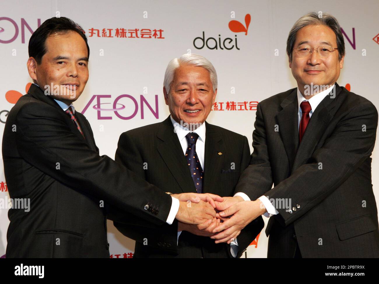 Presidents Motoya Okada, left, of Aeon Co., Nobuo Katsumata, of ...