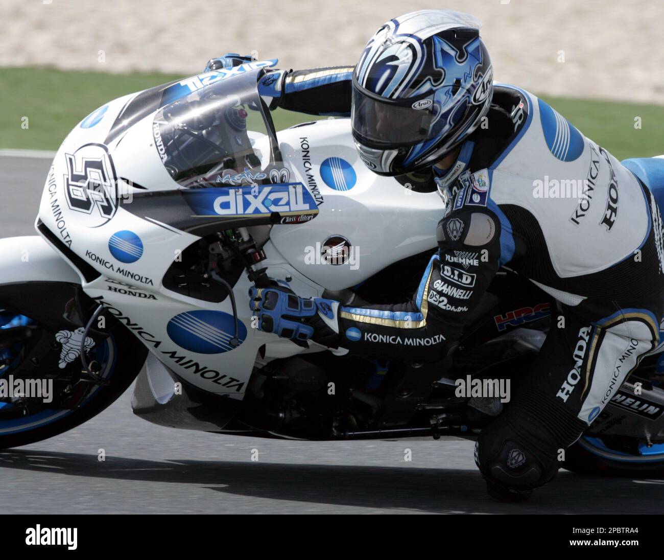Japan's MotoGP rider Shinya Nakano powers his Honda in a free practise ...