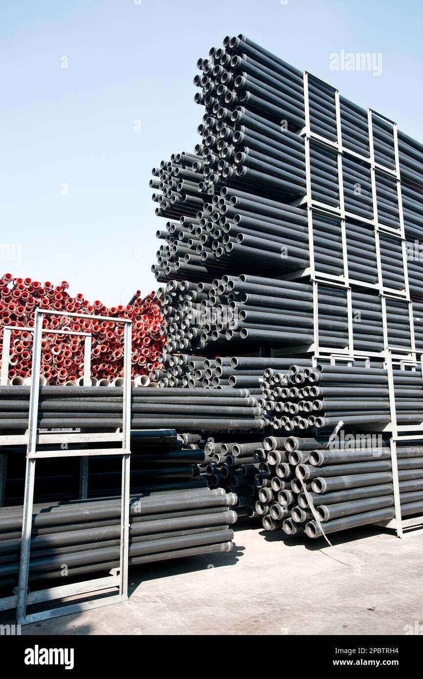 Bunches of PVC pipe sitting on palets at a wholesale pipe store Stock ...