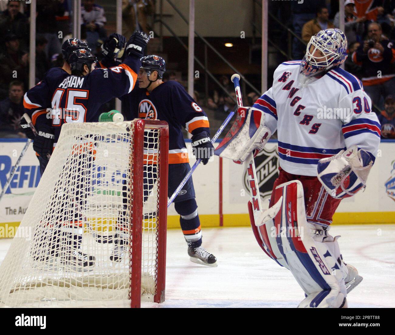 New York Islander's Arron Asham (45) and Sean Hill (6) congratulate ...