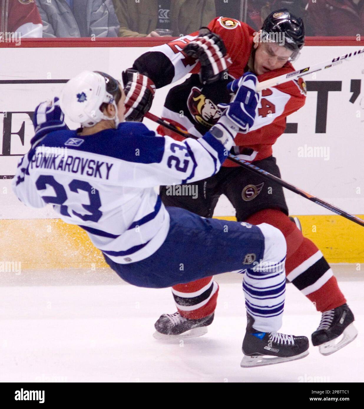 Ottawa Senators Anton Volchenkov, right, knocks Toronto Maple Leafs ...