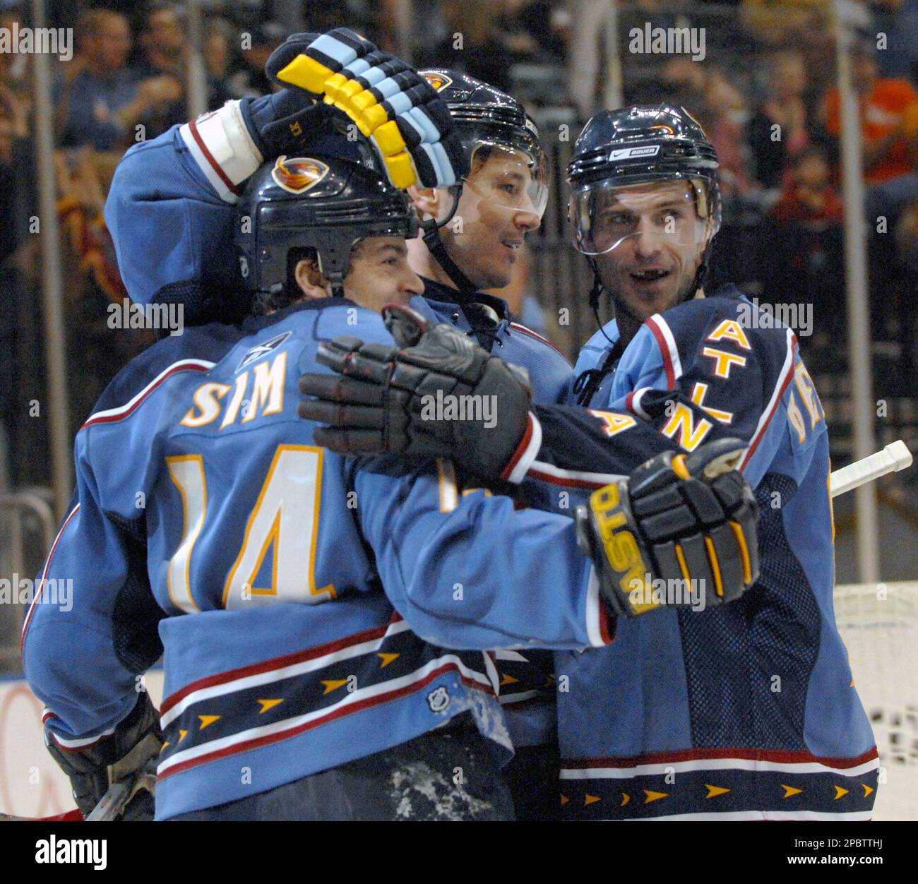 Atlanta Thrashers right wing Jon Sim (14) celebrates with Thrashers ...