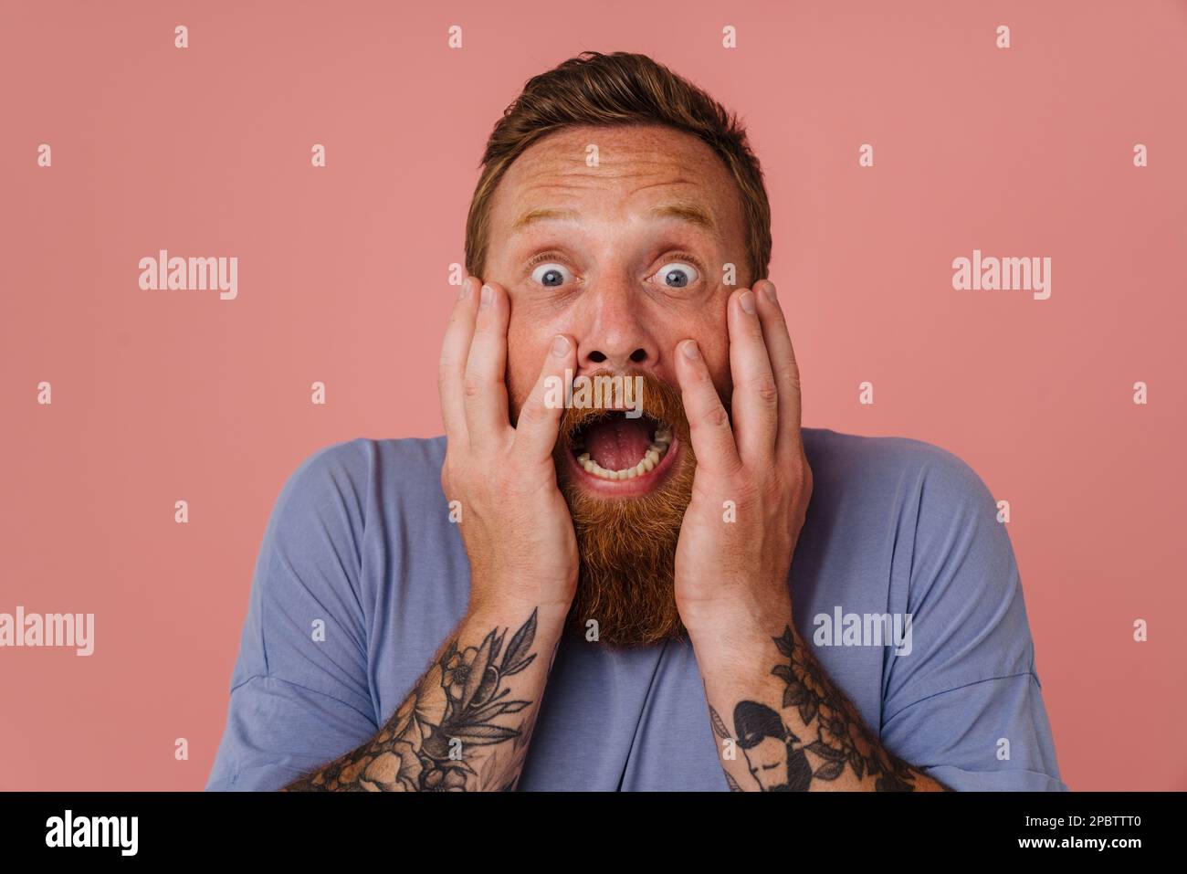 Ginger Scared Man With Beard Expressing Surprise At Camera Isolated