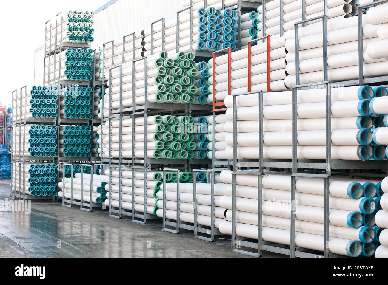 Bunches of PVC pipe sitting on palets at a wholesale pipe store Stock ...