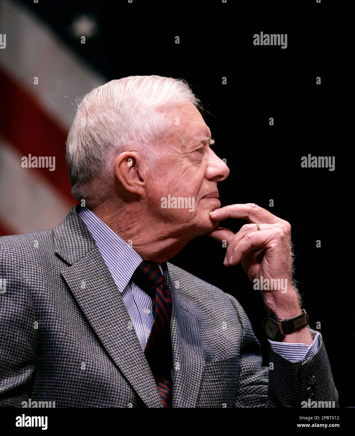 Former President Jimmy Carter listens after speaking about his new book ...