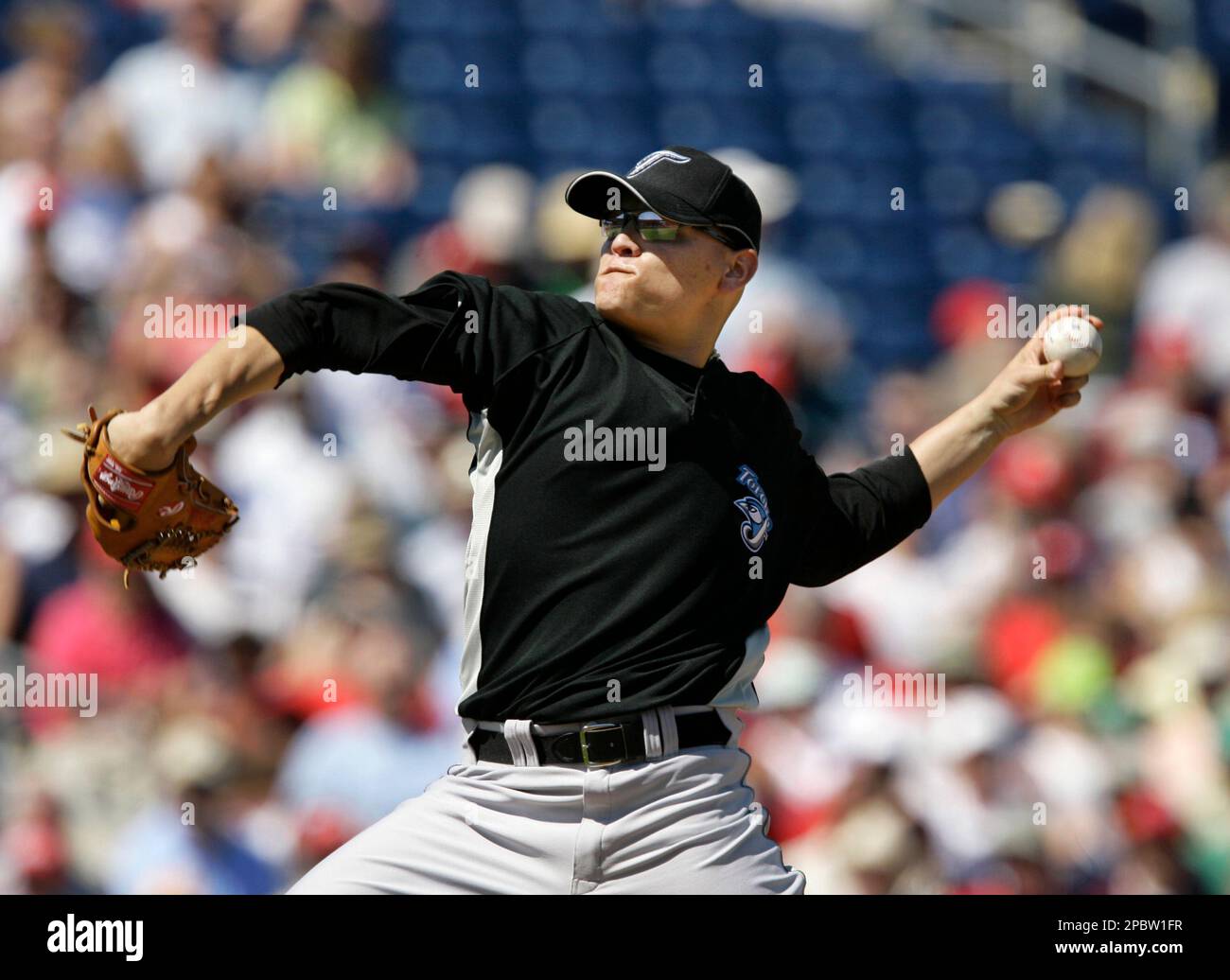 Toronto Blue Jays pitcher Gustavo Chacin winds up for a pitch against ...