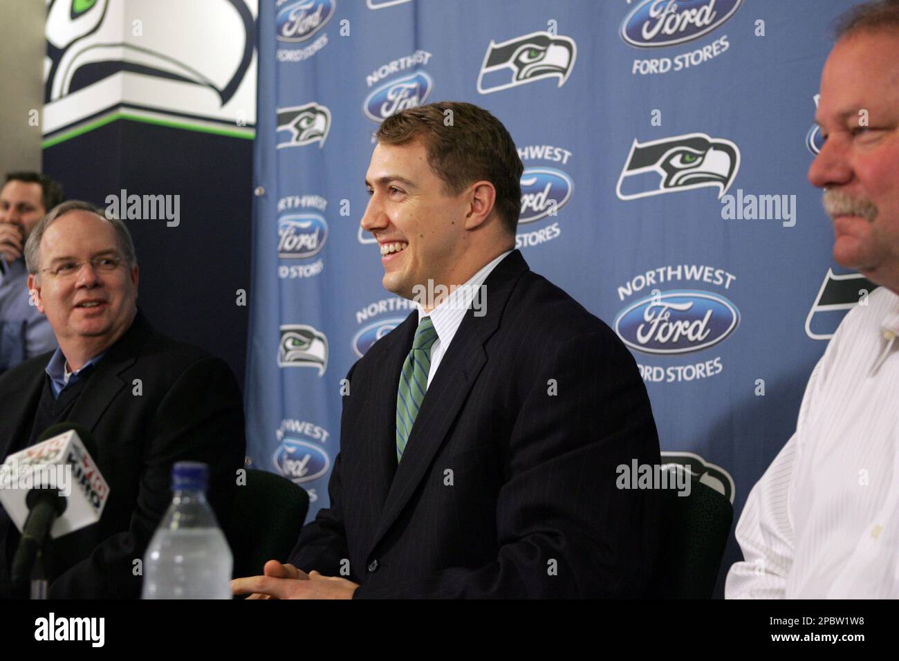 Seattle Seahawks' general manager Tim Ruskell, left, Patrick Kerney ...