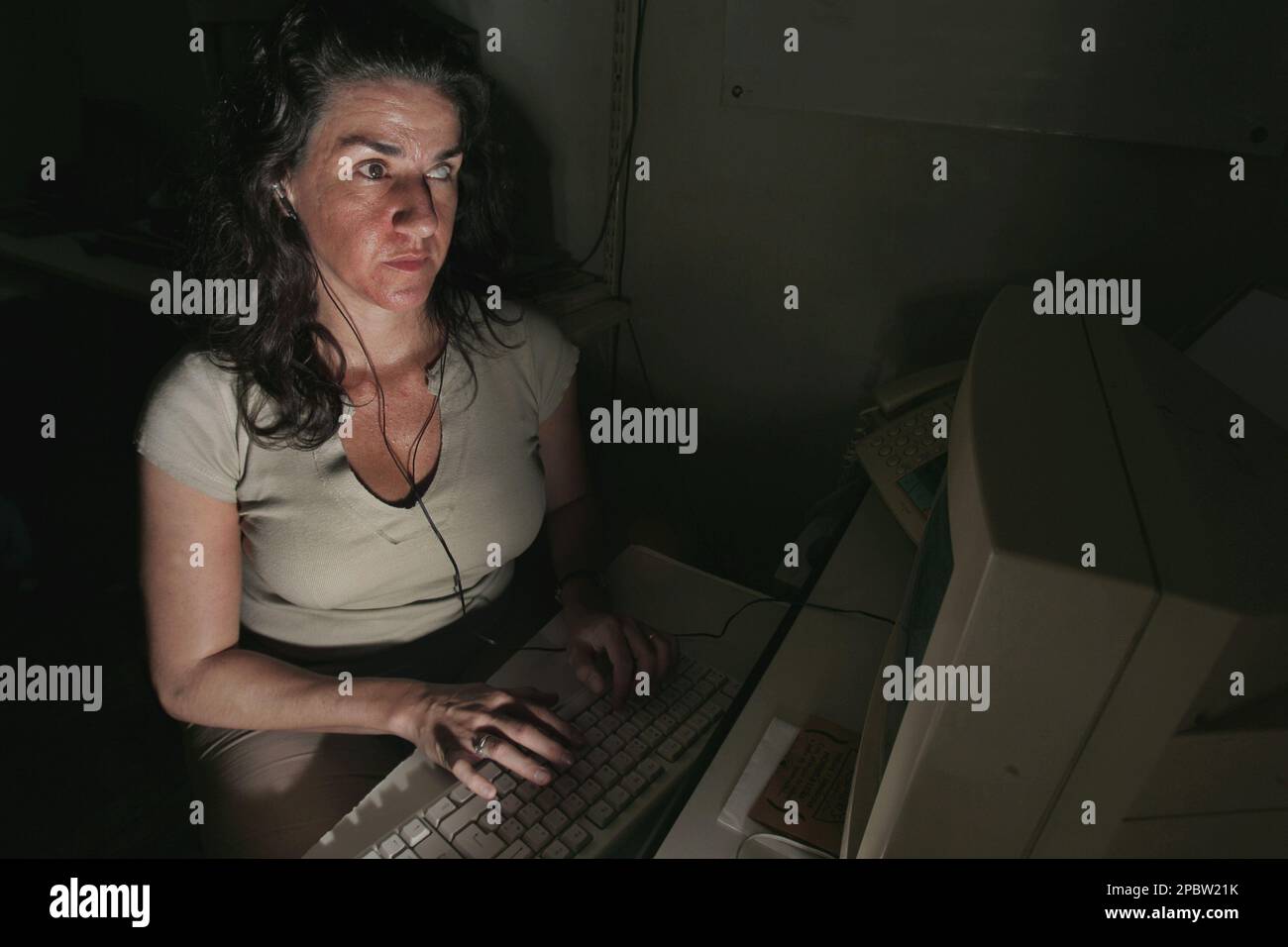 Marta Traina, 37, operates a computer at Tiflolibros, an online library ...