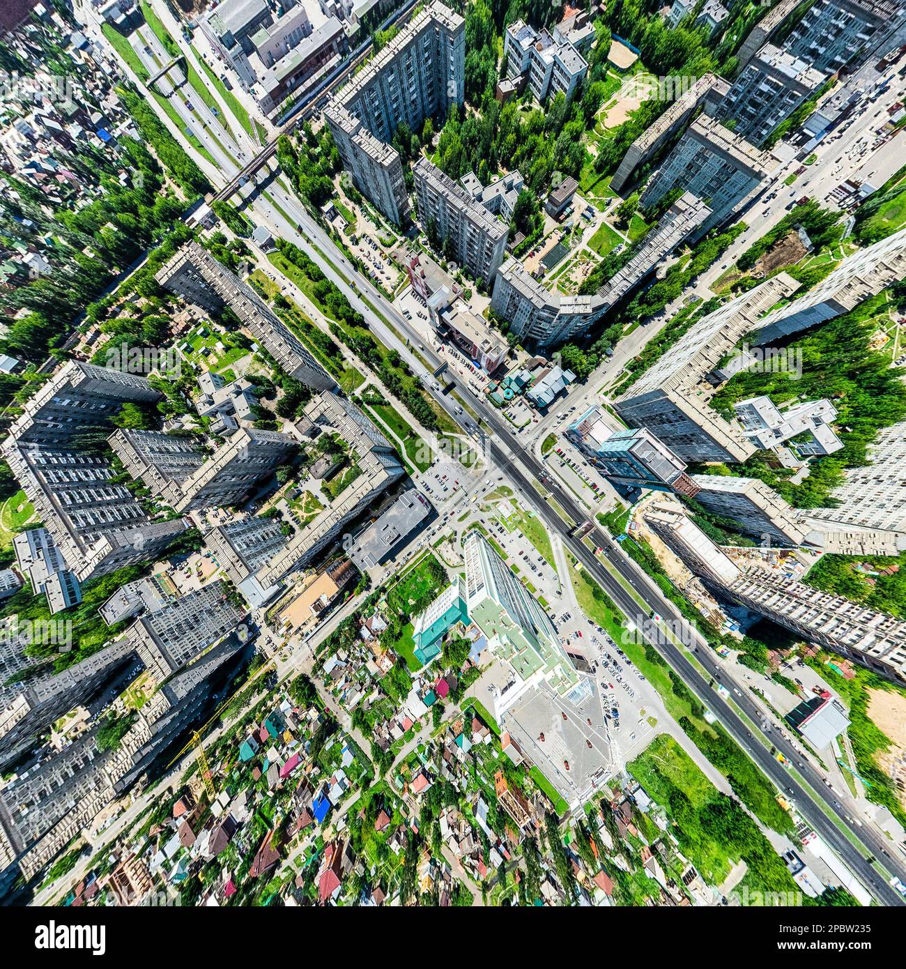 Aerial city view with crossroads and roads, houses, buildings, parks ...