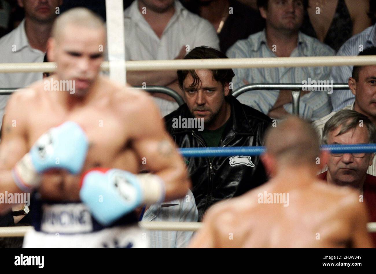 Movie star Russell Crowe, center, watches the fight between Australian ...