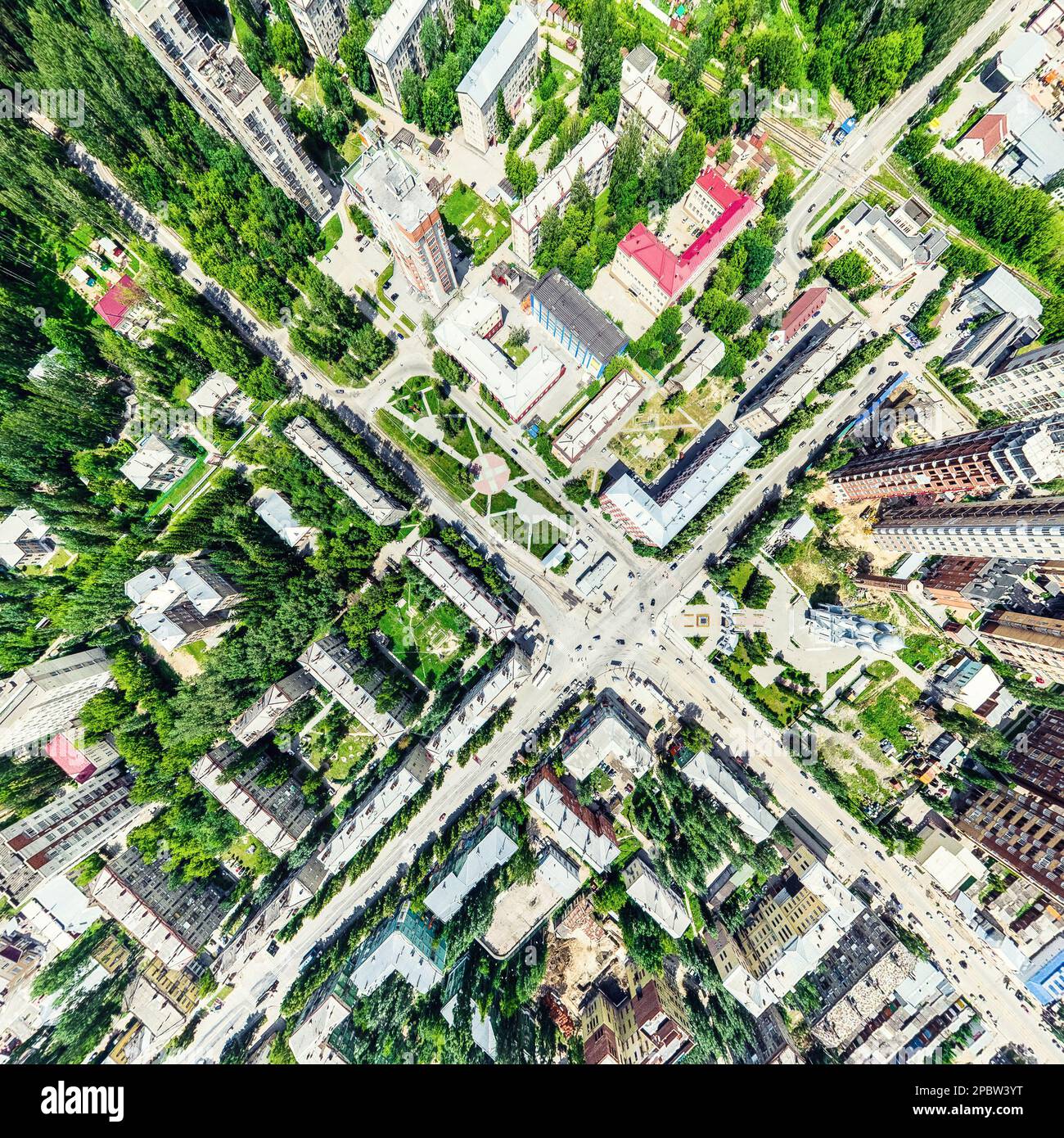 Aerial city view with crossroads and roads, houses, buildings, parks ...