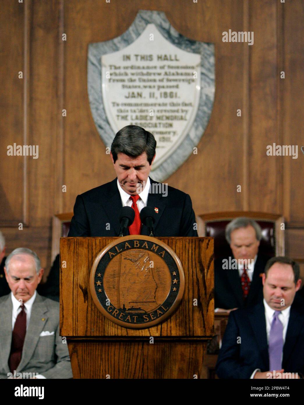 Alabama Gov. Bob Riley, center, and members of the Alabama Legislature ...