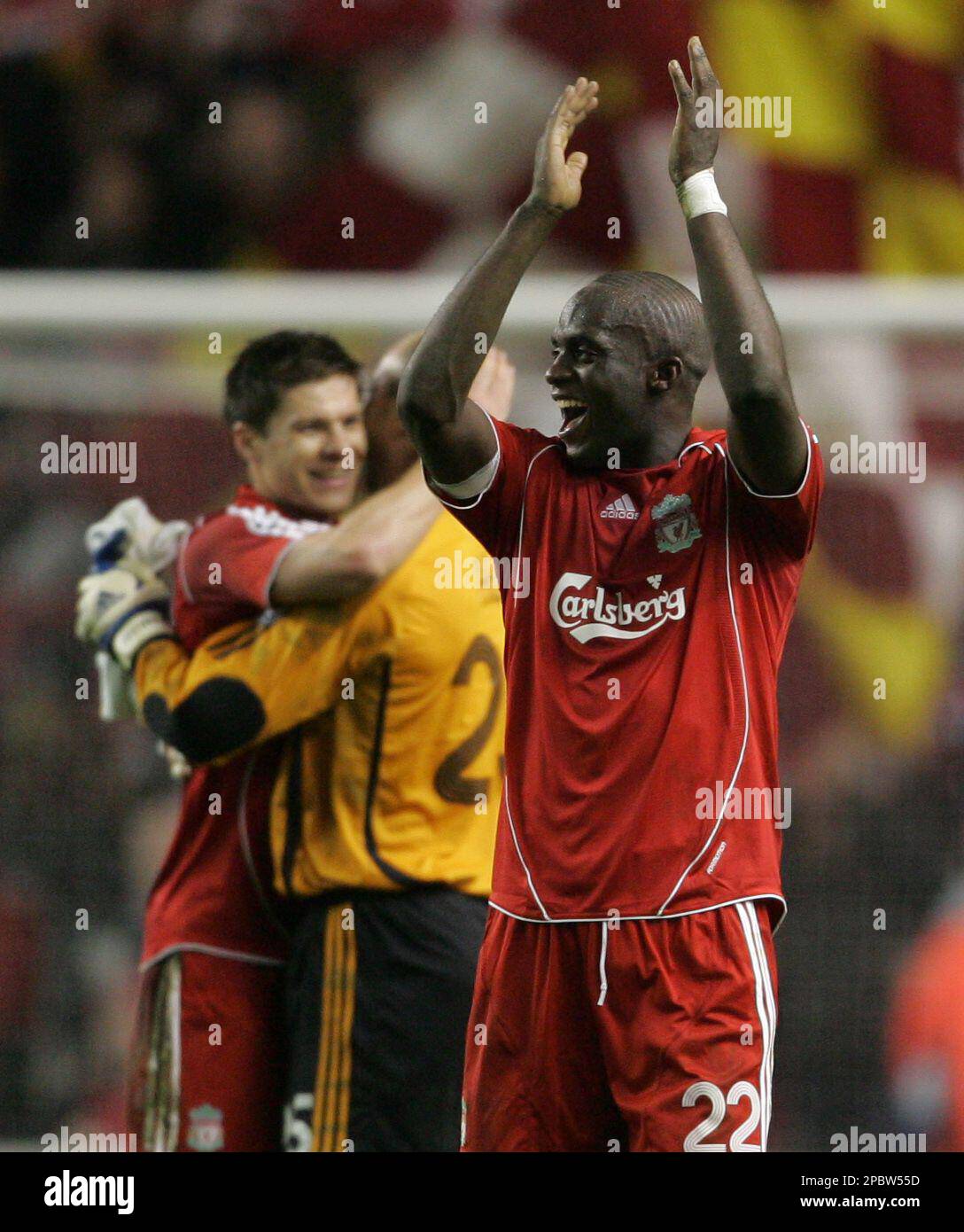Liverpool's Mohamed Sissoko, right, celebrates after his team's ...