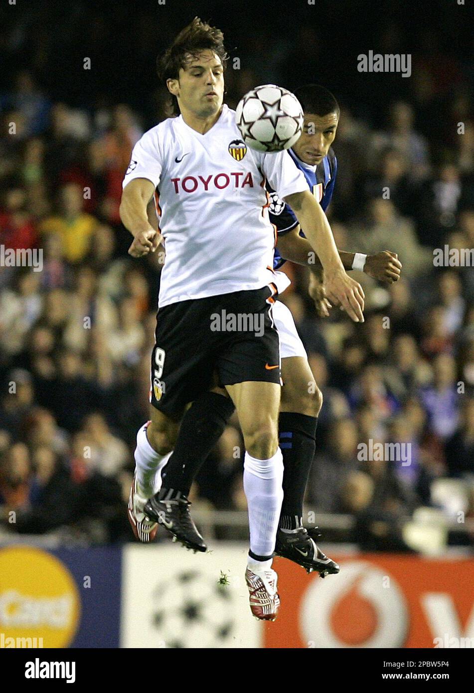 Inter Milan defender Ivan Cordoba, right, of Colombia, and Valencia ...