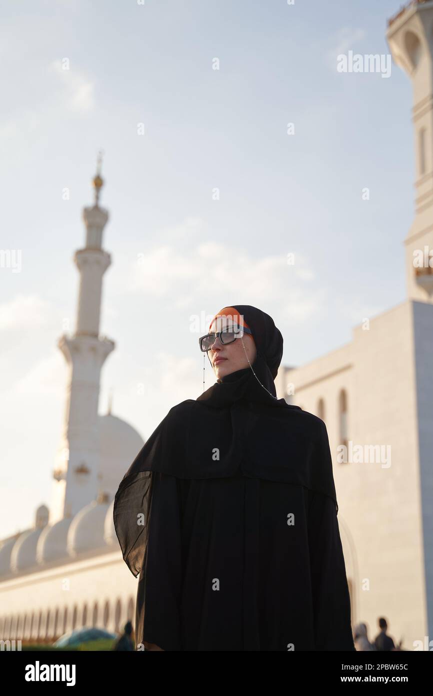 Female muslim traveler is sightseeing in Arab country at sunset Stock ...
