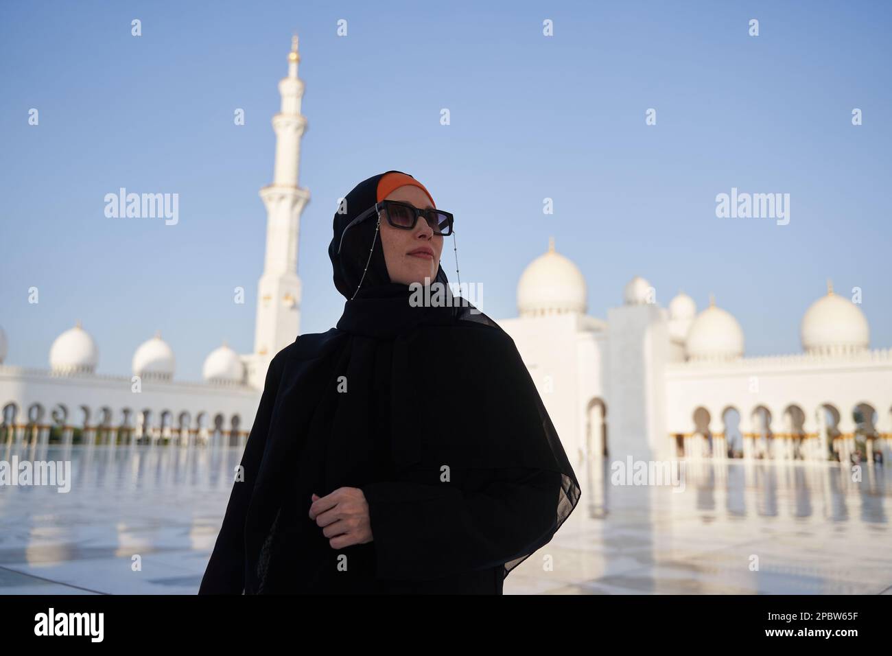 European woman is wearing women's arab national clothes in mosque Stock ...