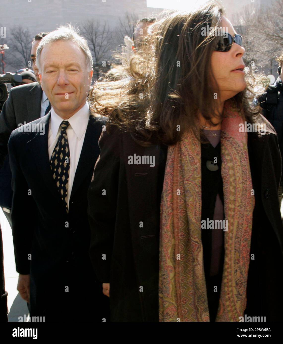 Former White House aide I. Lewis "Scooter" Libby, left, follows his ...