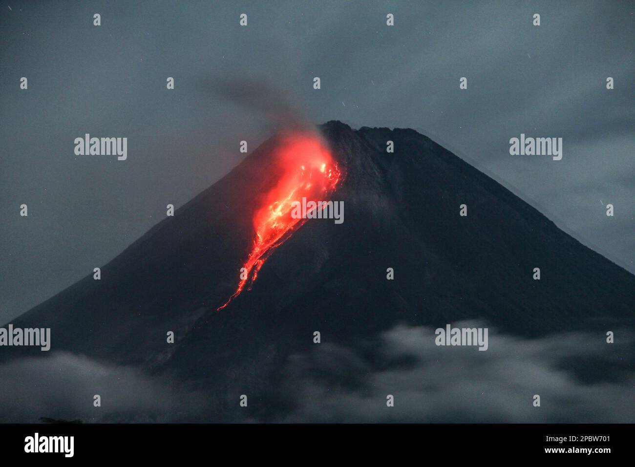 March 12, 2023, SLEMAN, YOGYAKARTA, INDONESIA: Mount Merapi has reddish ...