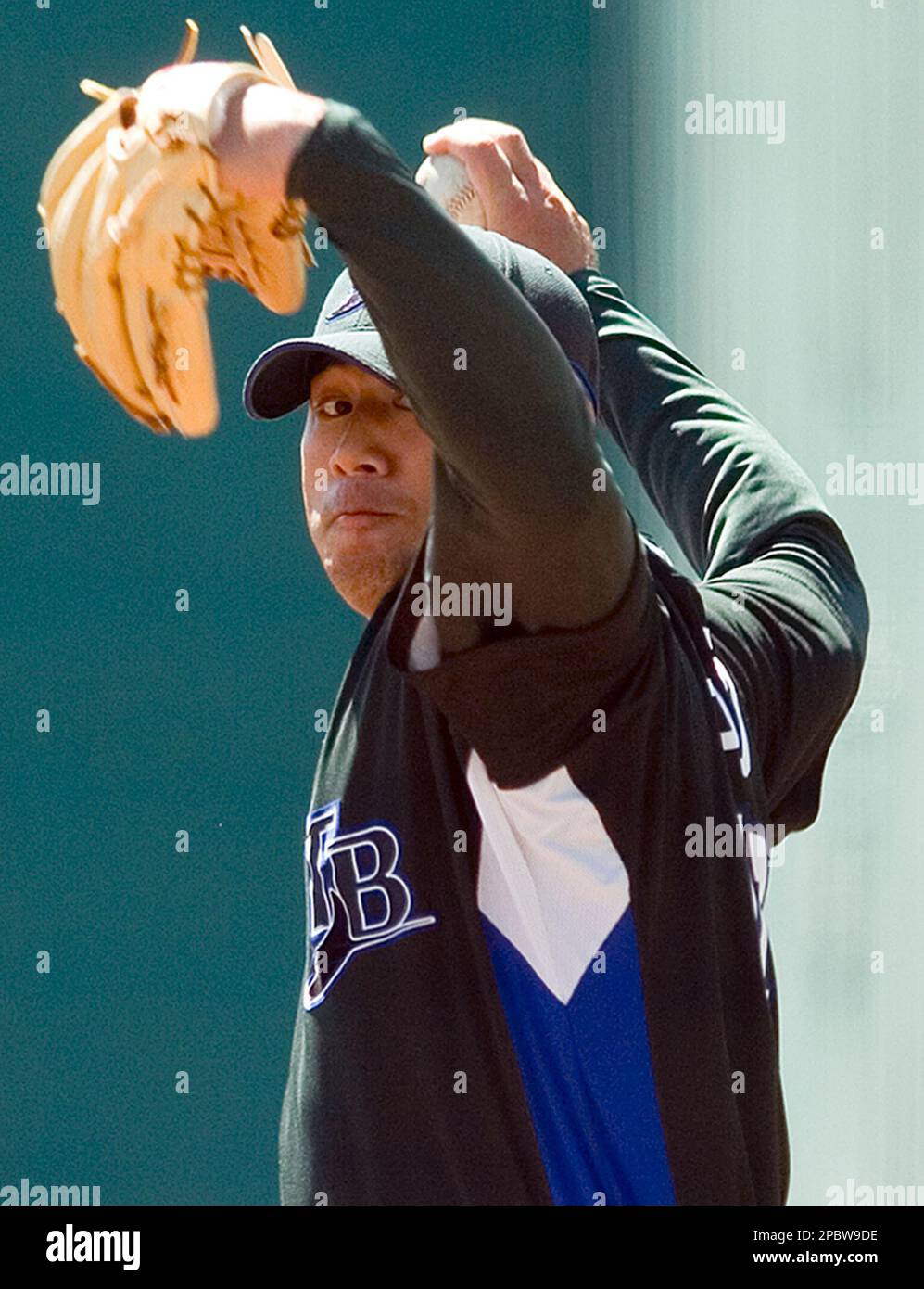 Tampa Bay Devil Rays pitcher Jae Seo, of Korea, warms up in the bullpen ...